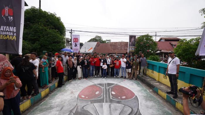 Warga di Binjai Lukis Superhero Kamen Rider di Jembatan Mencirim, Ini ...